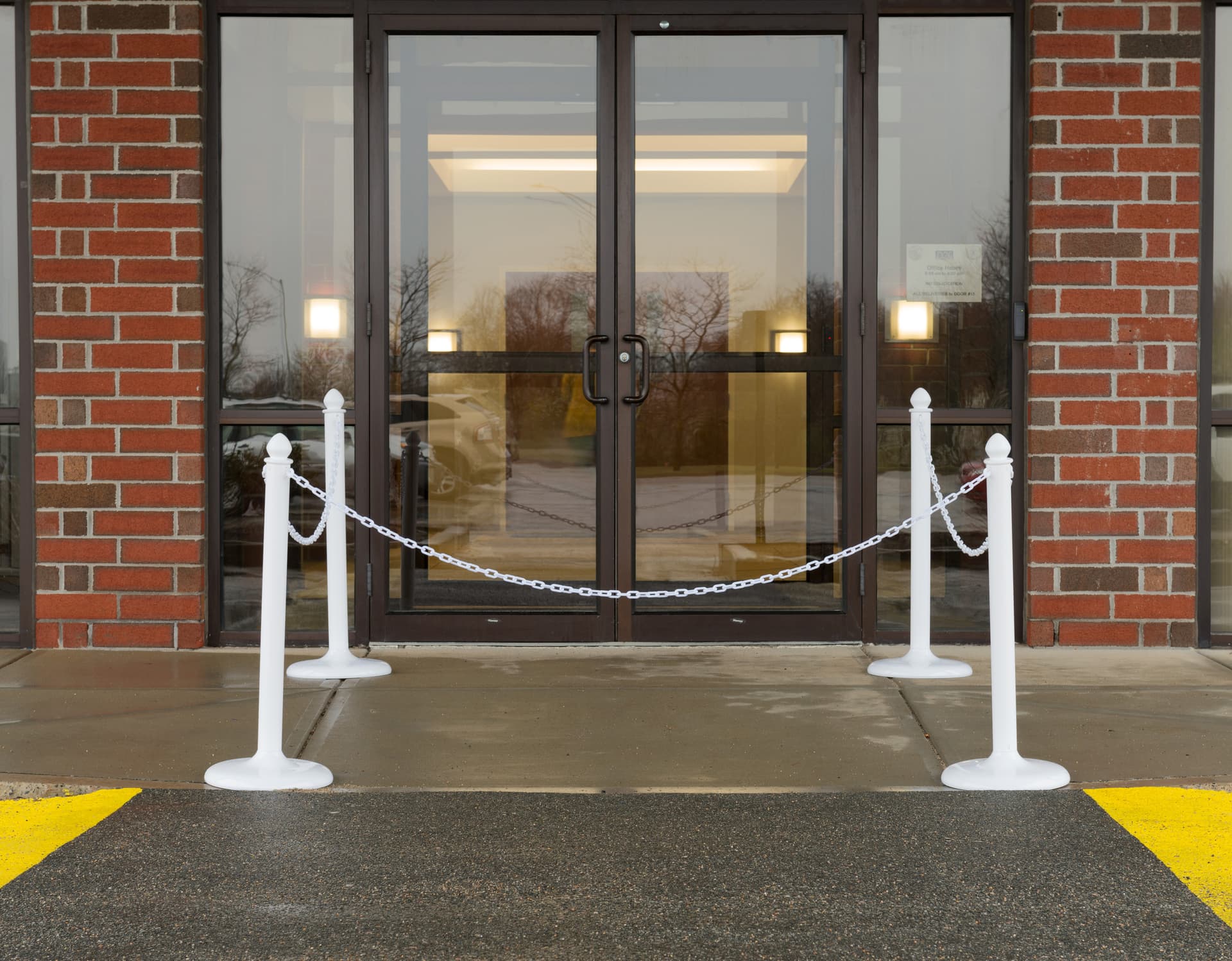 Yellow Plastic Post Stanchions | Weighted Sand-Filled Base | Displays2Go
